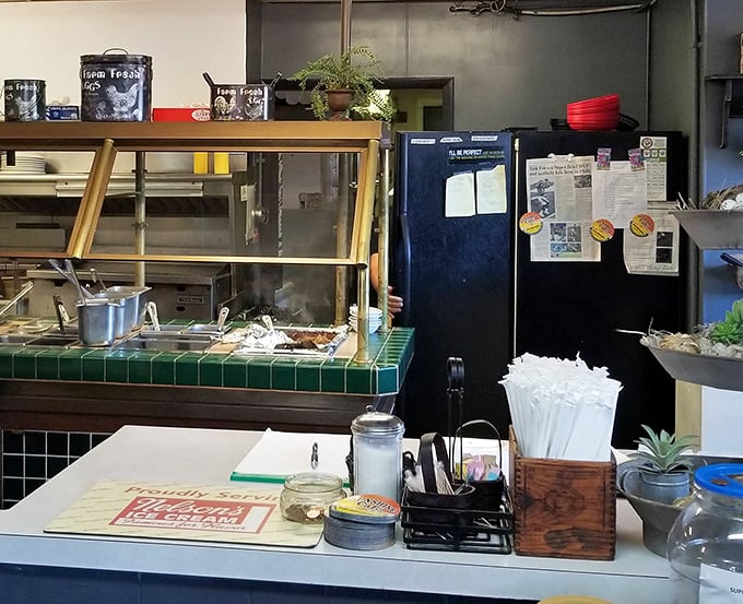 The service counter reveals the organized chaos of a well-run diner kitchen – where breakfast magic happens without revealing all its secrets.