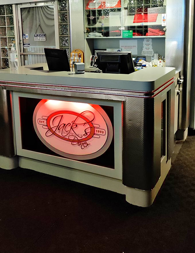The front counter glows with retro promise. That illuminated Jack's sign isn't just decoration—it's a beacon of hope for the hungry.