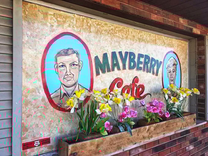 Spring flowers frame the iconic Mayberry Cafe sign, adding a touch of color to this shrine of nostalgic Americana and comfort cooking.