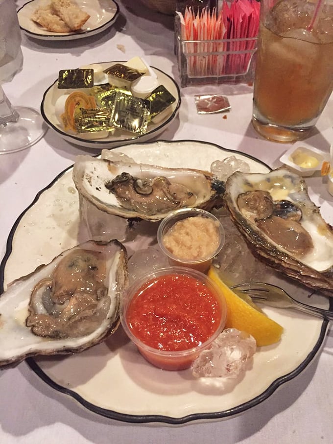 Fresh oysters served with classic accompaniments—proof that sometimes the ocean knows best and humans should just get out of the way.