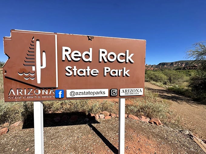 The official park sign promises environmental education, but really it's announcing the entrance to nature's greatest theater.