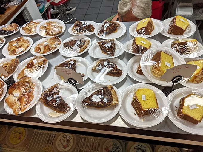 A dessert display that makes choosing just one slice the hardest decision you'll face all day. Life's too short—try them all.