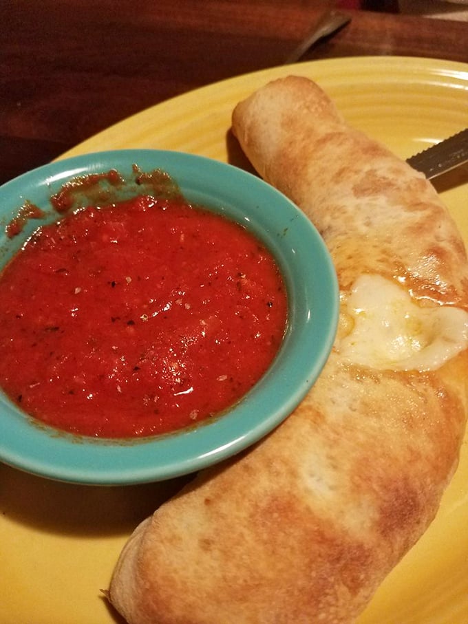 This pepperoni roll isn't messing around—it's the superhero of appetizers, cape optional, marinara dipping sauce mandatory.