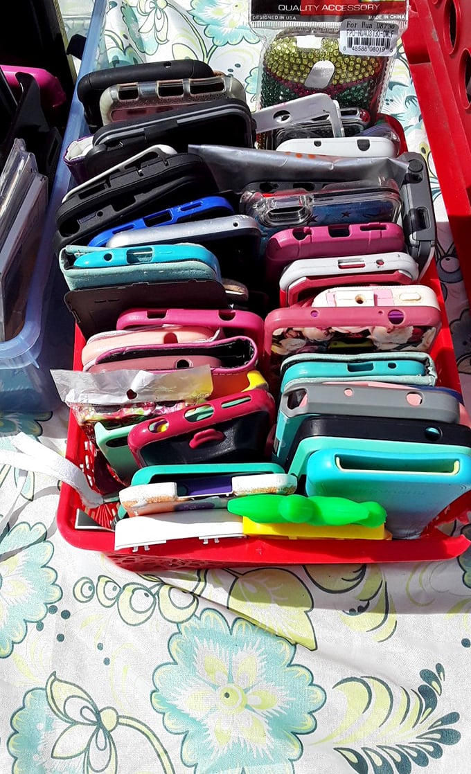 A technicolor sea of phone cases—technological fashion statements at prices that won't require calling your accountant afterward.