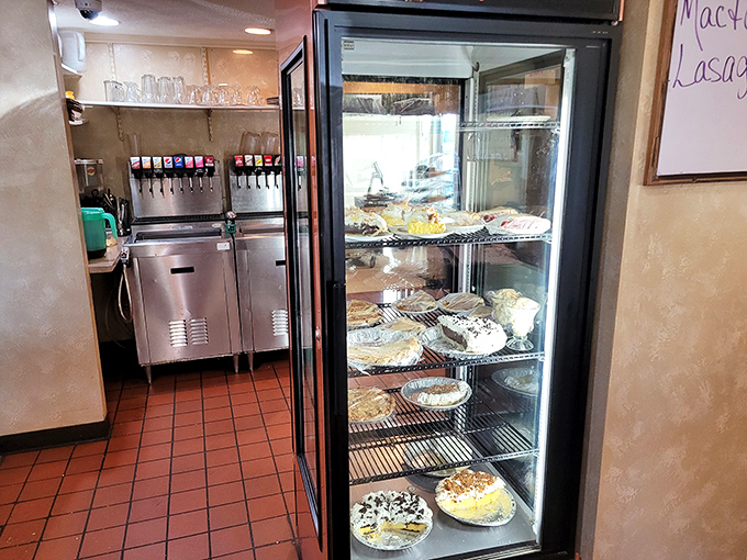 The pie display case – where willpower goes to die and happiness begins its sugary reign.