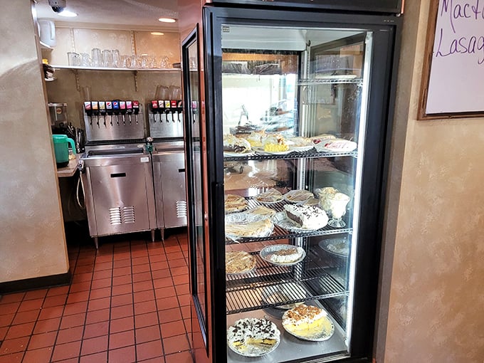 The pie display case – where willpower goes to die and happiness begins its sugary reign.