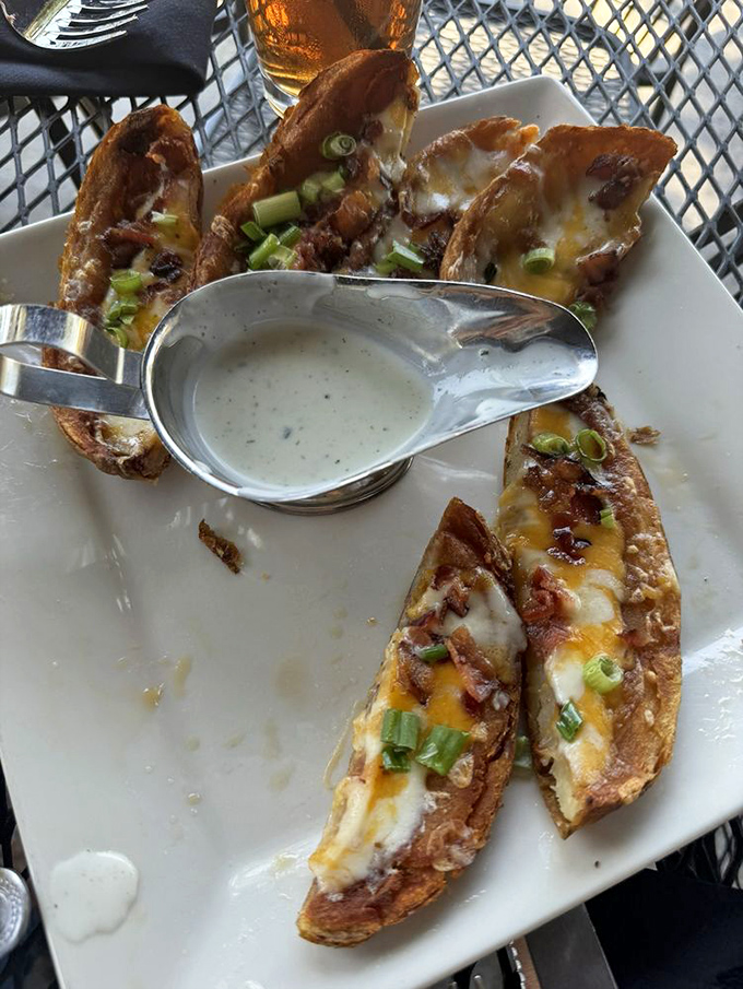 Potato skins loaded with melty cheese and bacon—the kind of nostalgic appetizer that reminds you why some classics never need reinvention.