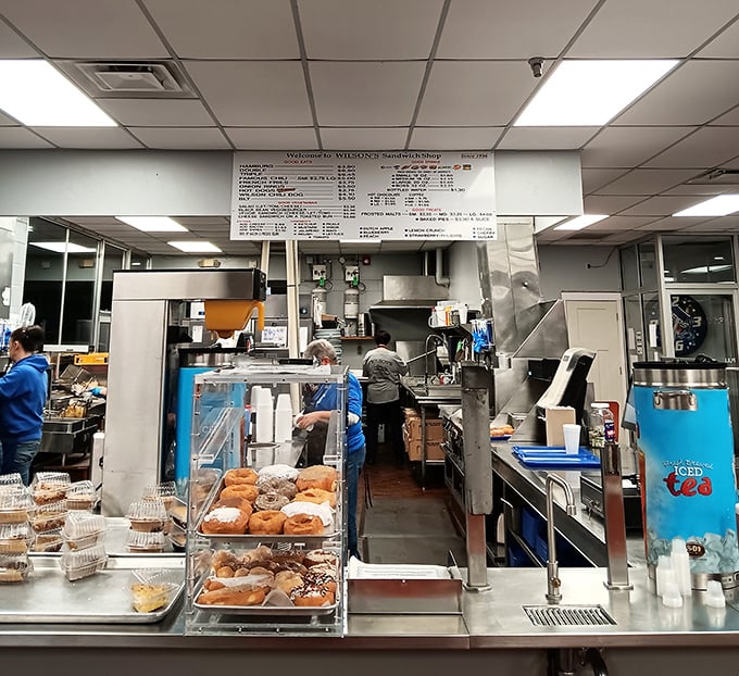 The preparation area buzzes with the choreographed efficiency of people who know comfort food is serious business.