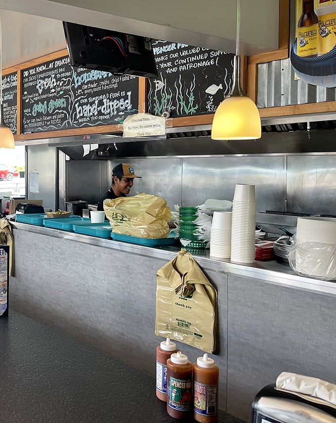 Behind every great taco is a kitchen where magic happens – bottles of that secret Spencer Sauce standing ready for their moment of glory.