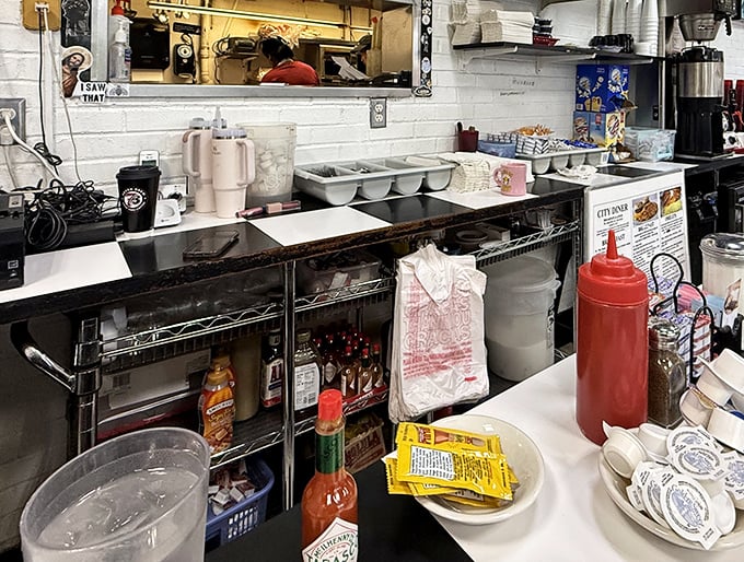 The prep area reveals the beautiful simplicity behind diner magic—no molecular gastronomy here, just honest cooking tools that have served generations faithfully.