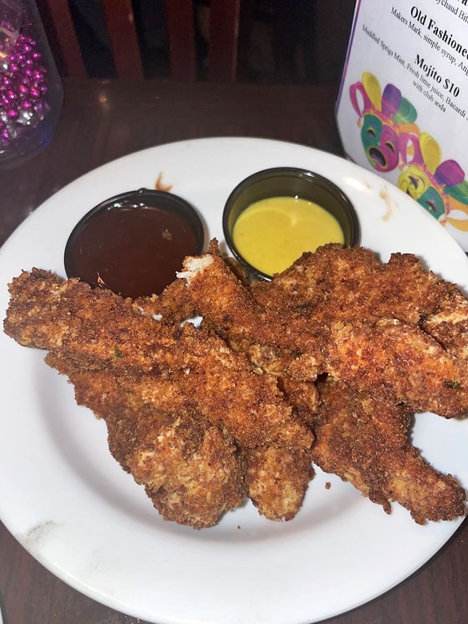 These aren't just any chicken tenders—they're the VIPs of the appetizer world, with dipping sauces that deserve their own fan club.