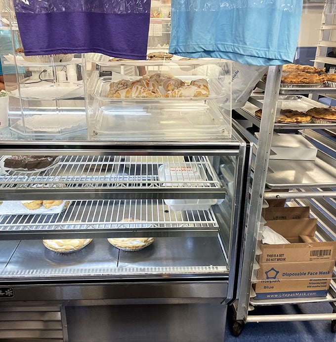 The pie display case—Michigan's version of a jewelry store window. Each shelf holds treasures more valuable than gold to those with a sweet tooth.