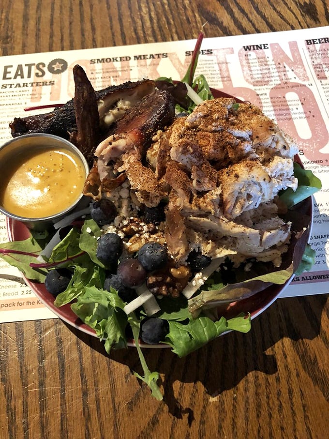 This isn't just a salad – it's a protein-packed flavor festival where smoky meat and fresh greens find harmony under a drizzle of golden dressing.