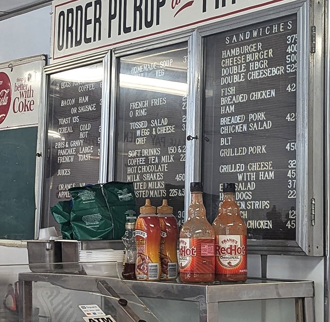 The condiment lineup—silent heroes of the burger experience. These bottles have seasoned more memories than most family photo albums.