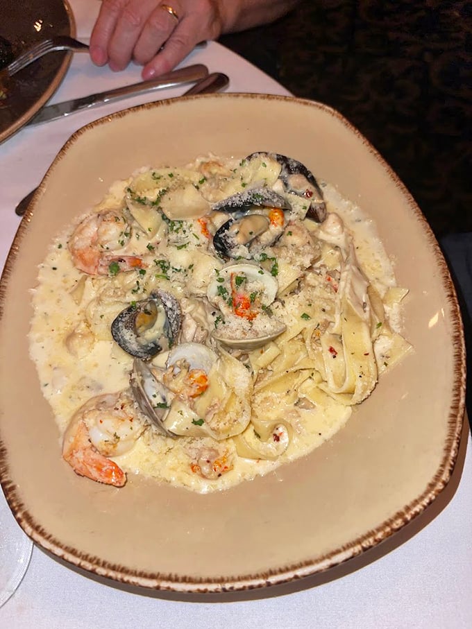 A seafood pasta so fresh you'll check for a tiny ocean under your table—clams, shrimp, and pasta dancing in perfect harmony.