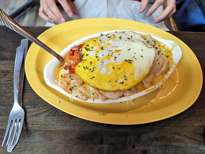 Shrimp and grits with a sunny-side egg crown—Southern comfort food that's dressed for success and ready to impress.