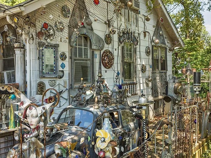 Rusty wheels and weathered metal find new purpose on this façade. Your HOA would have a collective aneurysm, but art lovers rejoice!