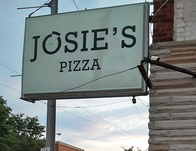 The sign says it all—no fancy fonts or marketing gimmicks needed when your reputation has been built one slice at a time.