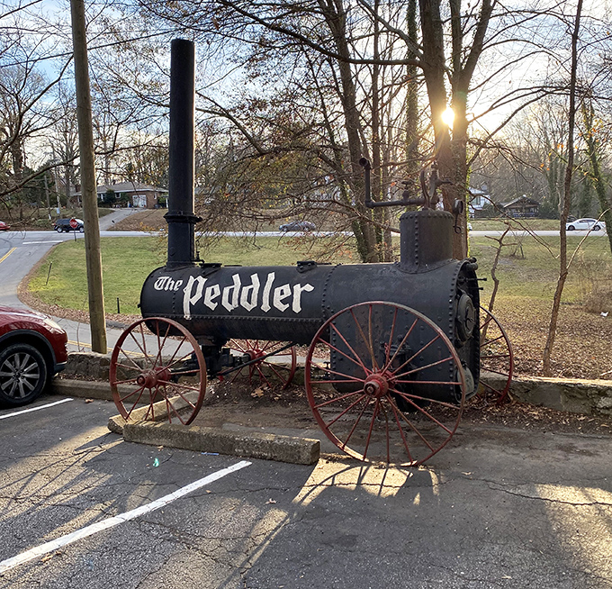 Not just a sign—a statement piece. This vintage steam engine announces The Peddler's presence with the same subtle charm as a foghorn.