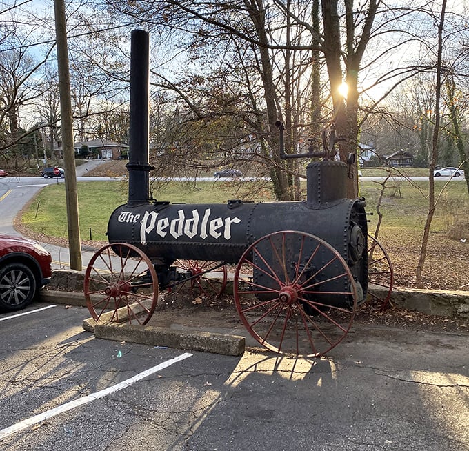 Not just a sign—a statement piece. This vintage steam engine announces The Peddler's presence with the same subtle charm as a foghorn.
