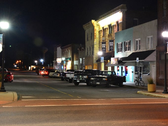 Night falls on Main Street, where the evening entertainment costs less than a fancy coffee in the big city.