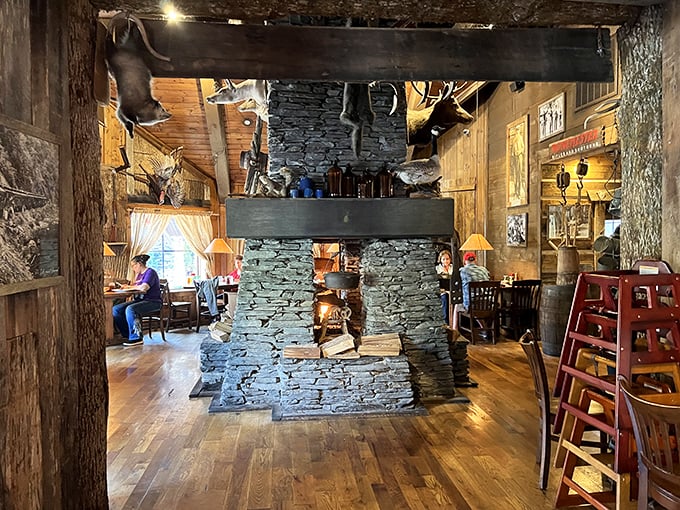 The heart of the restaurant—a magnificent stone fireplace that could tell tales of hungry hikers and vacation memories if only it could talk.