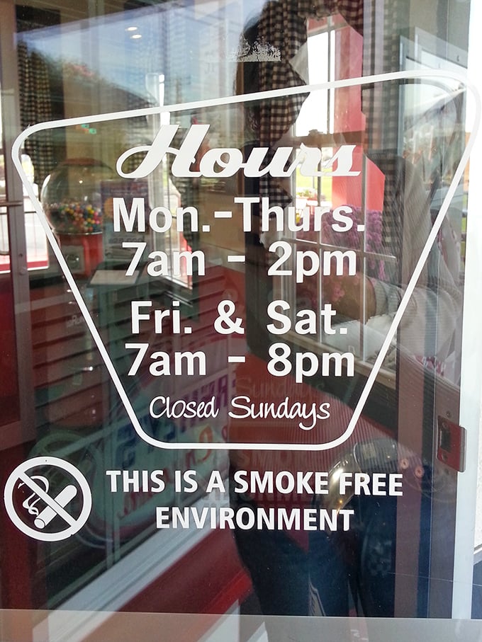 Hours posted with vintage flair. Notice they're closed Sundays—even time travelers need a day off.