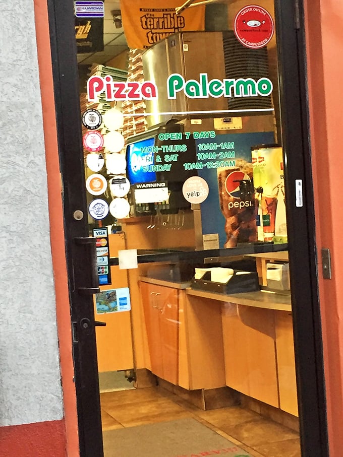The door tells the whole story—Pizza Palermo welcomes hungry visitors seven days a week, because pizza cravings don't take days off.