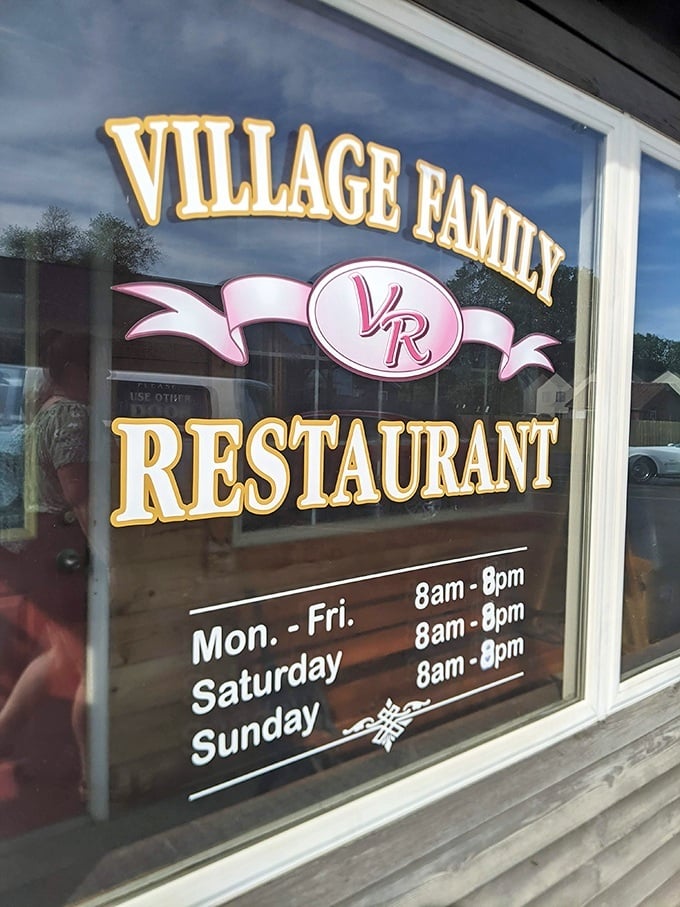 The window sign reveals the restaurant's sensible hours – because even comfort food perfectionists need time to recharge their culinary batteries.