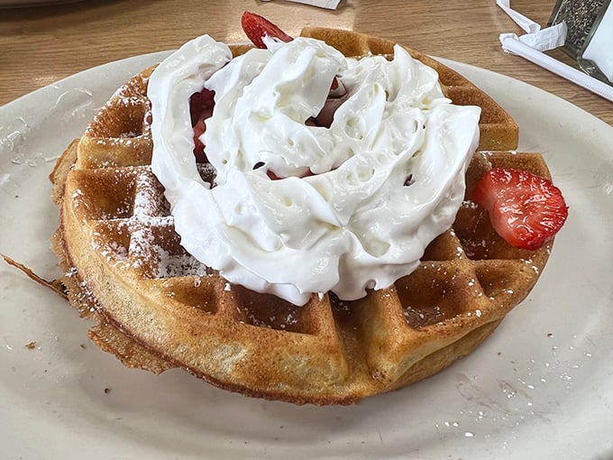 A Belgian waffle crowned with whipped cream and strawberries—the breakfast equivalent of wearing a tuxedo t-shirt. Fancy, but still knows how to party.