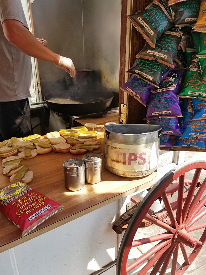 That tip container has probably funded college educations and first cars. Burger karma—what goes around comes around, especially when it's delicious.