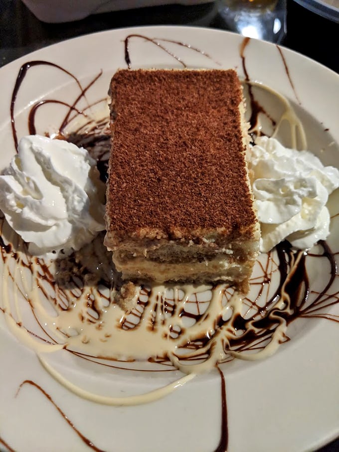 Tiramisu layered with precision that would impress an Italian grandmother—coffee-soaked ladyfingers and mascarpone cream creating the dessert equivalent of a standing ovation.