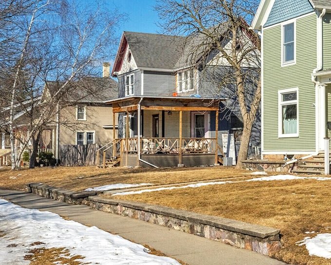 These classic Baraboo homes with welcoming porches practically whisper "come sit a spell"—architectural Midwestern hospitality at its finest.