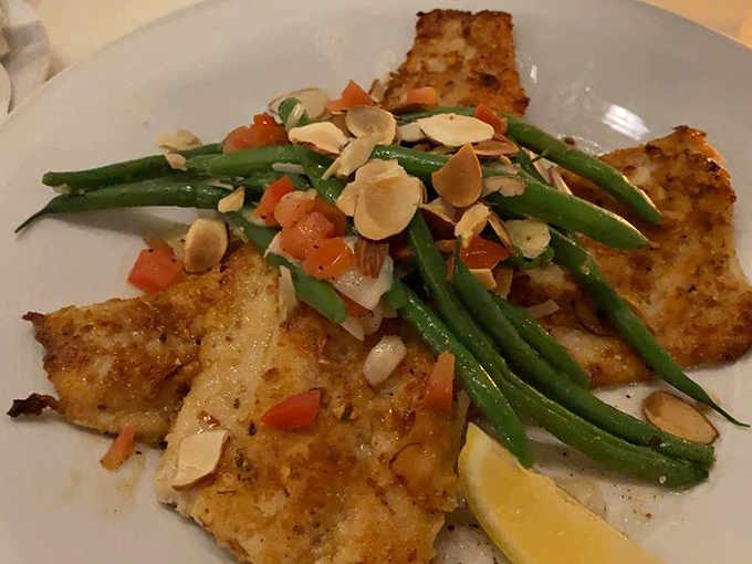 Trout with haricots verts and almonds—because sometimes the simplest combination of flavors creates the most memorable symphony.