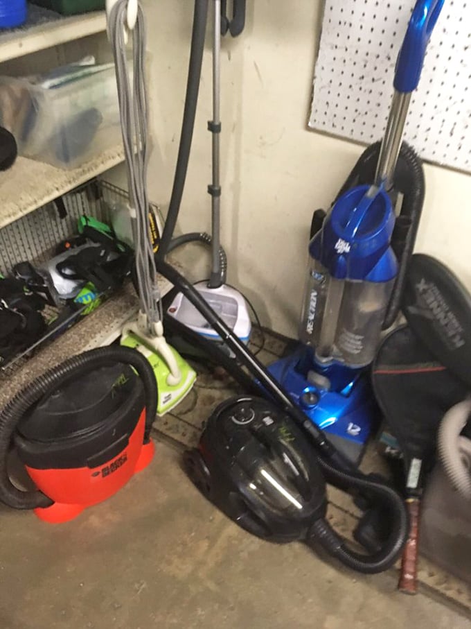 Vacuum cleaners standing at attention like an oddly specific army – ready to deploy against dust bunnies across the Central Coast.