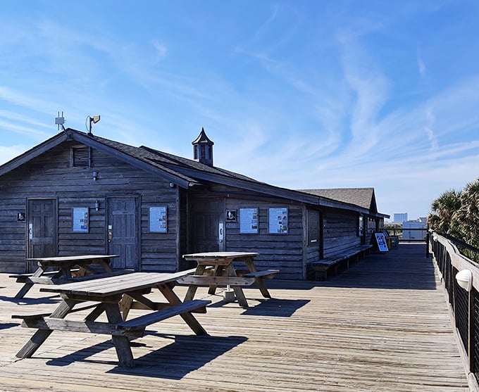 The visitor center stands as a weathered sentinel of hospitality, its rustic charm a perfect complement to the natural surroundings.