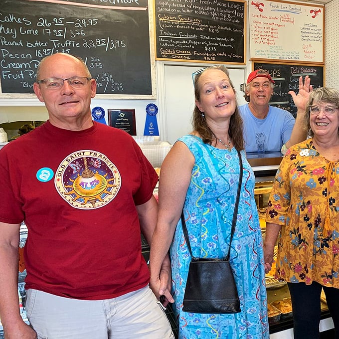 Happy customers who've just joined the "I've found the best pie in Florida" club. Their smiles tell you everything you need to know.