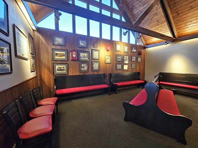 The waiting area's church pew seating and vintage photos create the perfect purgatory before BBQ heaven—worth every minute of anticipation.