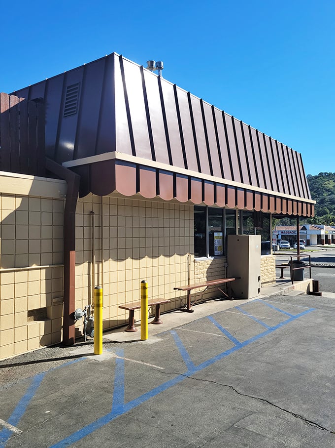 The side view reveals the shop's no-frills approach – it's not about fancy architecture, it's about what's happening inside those doors.