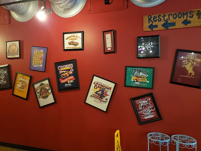The wall of framed Louisiana memorabilia serves as both decoration and education—a colorful reminder you're in Cajun territory now.