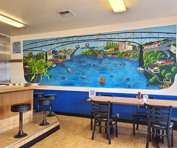 The mural isn't just decoration—it's a window into Seattle's soul. Lake Union comes alive on these tiles while you devour your breakfast.