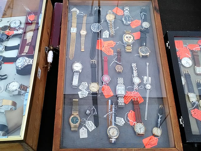 Vintage timepieces under glass – each one frozen at a moment someone once cared enough to wind. Time literally for sale!
