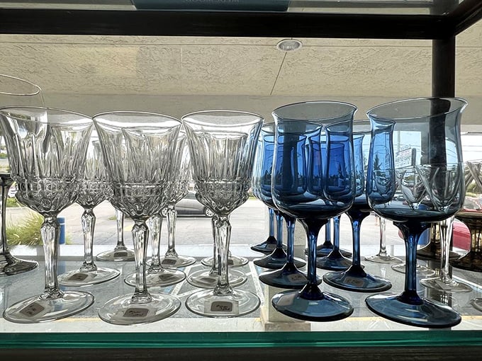 Crystal clear and cobalt blue stemware lined up like elegant soldiers, ready to elevate your Two-Buck Chuck to sommelier status.