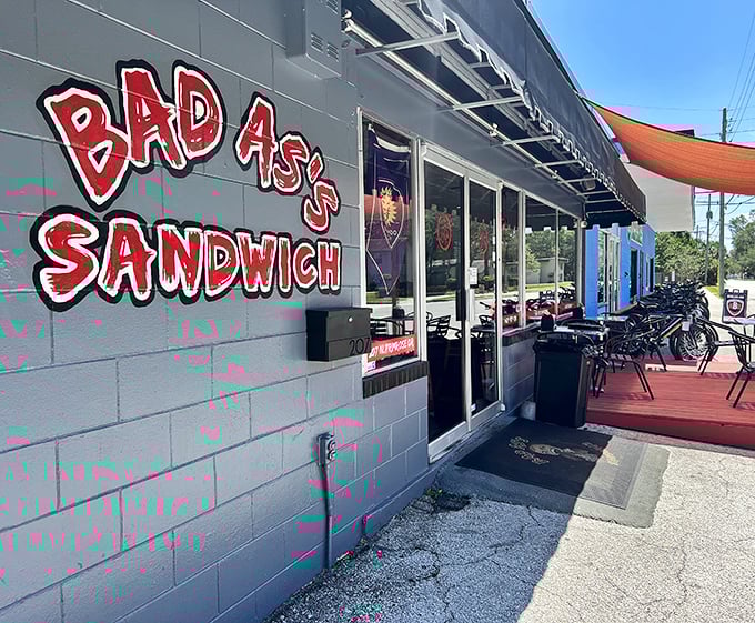 "BAD ASS SANDWICH" isn't just a name – it's a mission statement painted in rebellious red on this unassuming gray building.