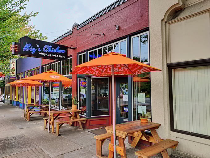 Orange umbrellas and outdoor seating create the perfect stage for Portland's chicken and jo-jo show.