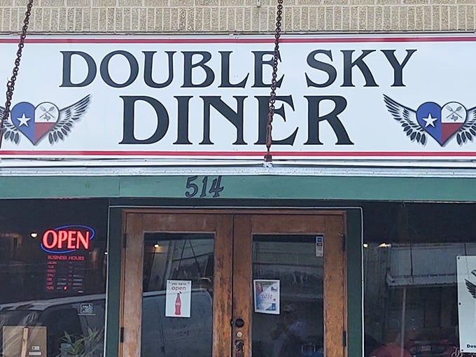 Double Sky Diner's sign features Texas pride with winged hearts – comfort food that makes spirits soar.