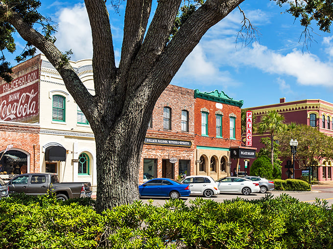 Victorian elegance meets island living where ancient oaks shade streets filled with coastal magic.