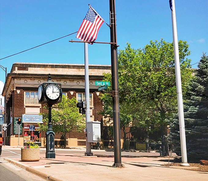 Iron Mountain's main street stretches toward distant hills, where the journey matters more than the destination you're seeking.