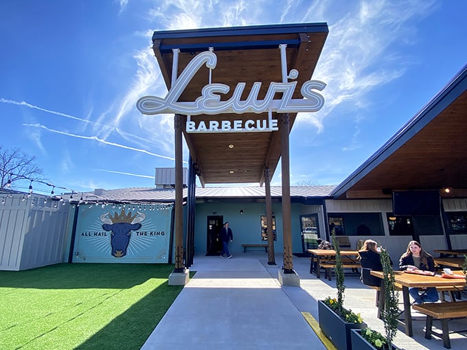 Lewis Barbecue's modern entrance and outdoor seating area – where Texas meets Carolina in meaty harmony.