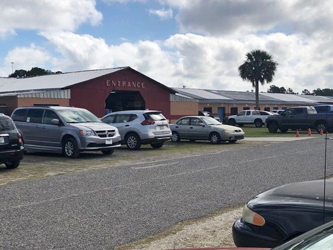 Pecan Park's rustic entrance welcomes visitors to where farmers market freshness meets vintage treasure hunting.
